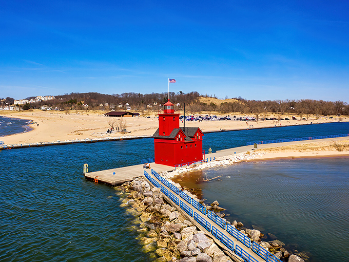 Holland State Park: Where Lake Michigan shows off its best blue against Big Red's vibrant charm. Pure Michigan magic in every direction.