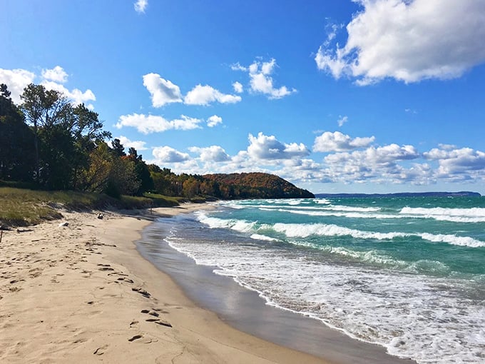 Van's Beach stretches out like nature's welcome mat, where turquoise waters meet golden sands under Michigan's boundless sky.