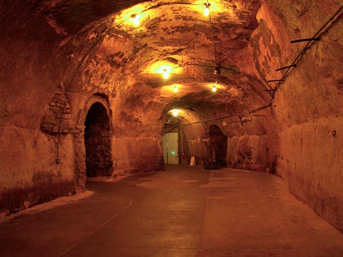 The main chamber glows with warm lighting that makes ancient sandstone look like it's auditioning for a period drama about sophisticated bootleggers.