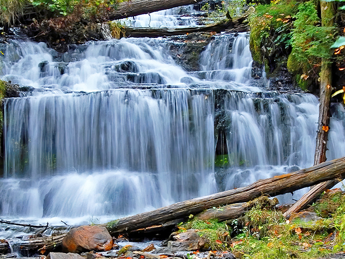 Wagner Falls cascades gracefully over ancient rock ledges, creating nature's perfect staircase of tumbling water in Michigan's Upper Peninsula.
