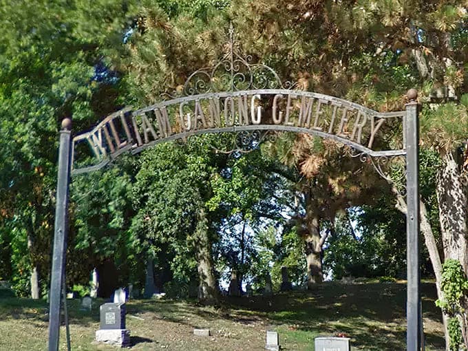 That wrought-iron archway has welcomed visitors for over a century, standing guard like a patient sentinel that never takes a coffee break.