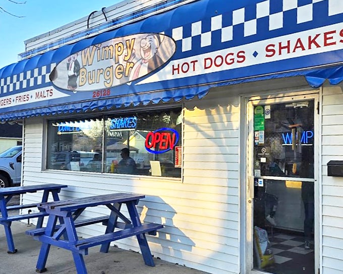 The iconic blue and white checkered awning of Wimpy Burger stands as a beacon of burger bliss in St. Clair Shores, promising simple pleasures done right.