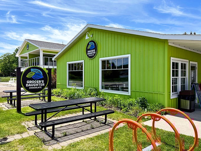 The eye-catching lime green exterior of Grocer's Daughter Chocolate stands out like a sweet beacon, promising delicious adventures within its walls.