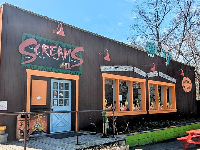 The dark exterior with bright orange trim and blue door of Scream's Ice Cream stands like a Halloween fever dream in broad daylight. Welcome to Hell... Michigan, that is.
