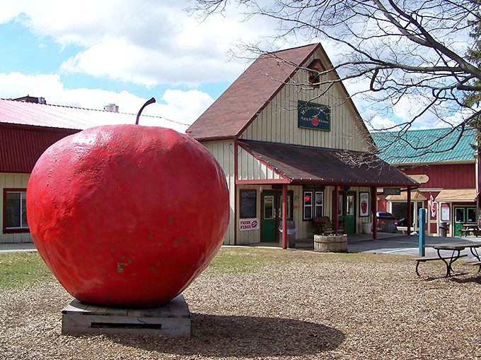 That giant red apple isn't compensating for anything, it's just confidently announcing the deliciousness that awaits inside this Grand Rapids treasure.