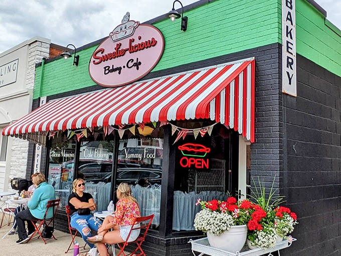 The vibrant green exterior with its classic red-and-white striped awning isn't just inviting&mdash;it's practically shouting "Get in here and eat pie now!"