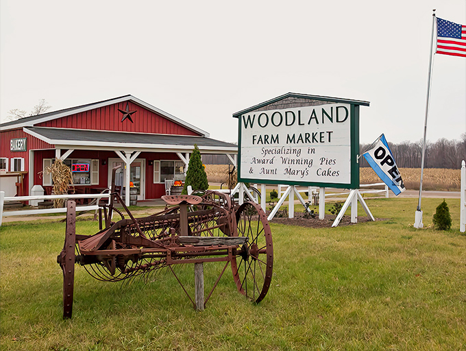 The iconic red barn exterior of Woodland Farm Market beckons with rustic charm and the promise of delicious treasures within.