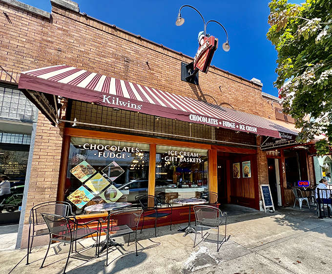 The iconic red-and-white striped awning beckons sweet-toothed visitors like a sugary lighthouse on Harbor Springs' Main Street.