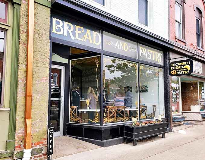 The elegant black storefront of Tecumseh Bread & Pastry beckons with golden lettering and promises of buttery delights within. Small-town charm, big-city pastry skills.