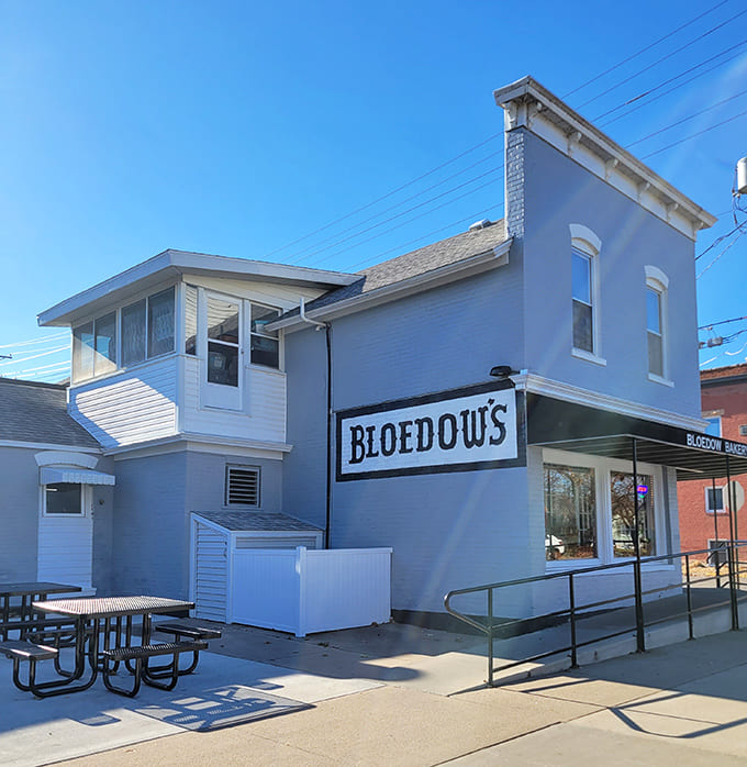 The unassuming white exterior of Bloedow's Bakery stands like a beacon of sweetness on Broadway, promising treasures that have drawn crowds since 1924.