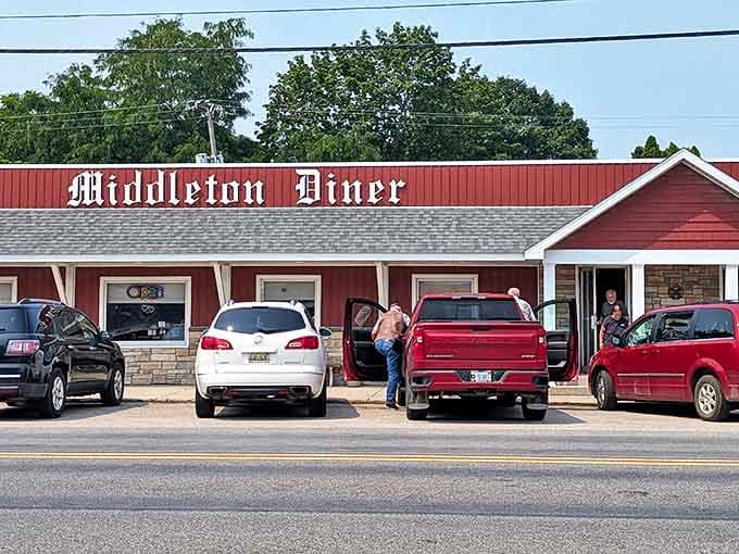 The iconic red exterior of Middleton Diner stands proudly along the roadside, a beacon of comfort food that's been drawing hungry travelers for generations.