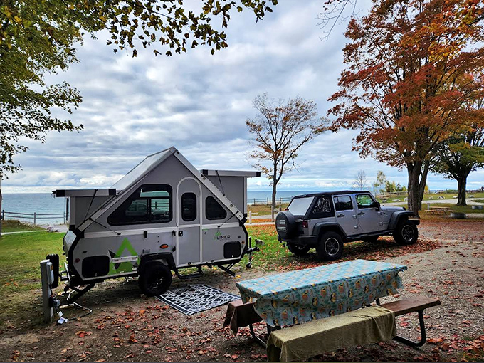 Compact camping perfection: this A-liner proves you don't need mansion-sized RVs to experience lakeside luxury.