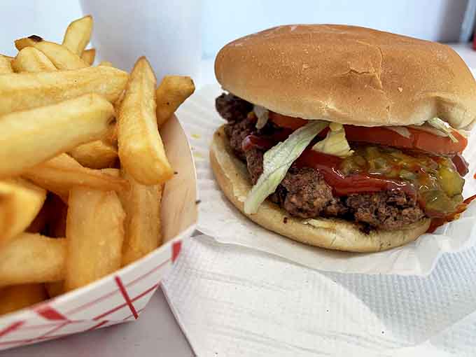All-American goodness: Simple perfection on a plate &ndash; golden fries beside a classic burger that reminds you why some food traditions never need updating.