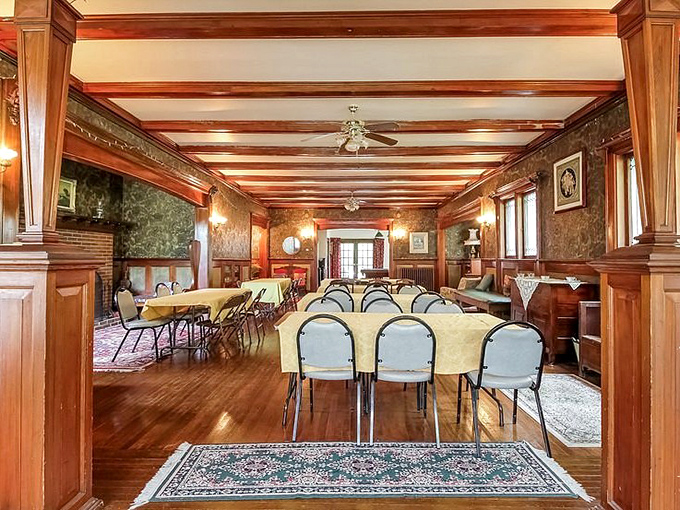 Expansive space with yellow-clothed tables ready for everything from wedding receptions to competitive board game tournaments.