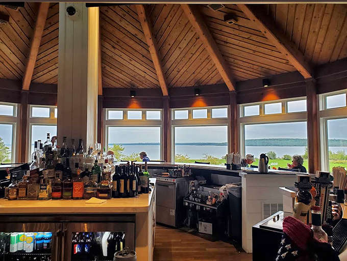 The bar area frames Lake Huron views so perfectly you might forget you came here to order a drink, not just stare at water.