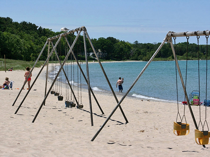 Childhood joy elevated: beach swings with a million-dollar view make Michigan Beach Park a playground like no other.