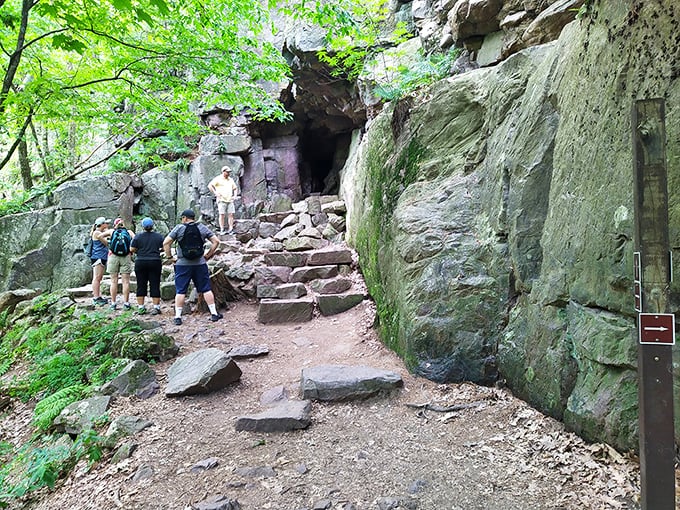 Hikers gather at Bison Rock, where nature's sculpture garden showcases what 1.6 billion years of geological artistry can create.