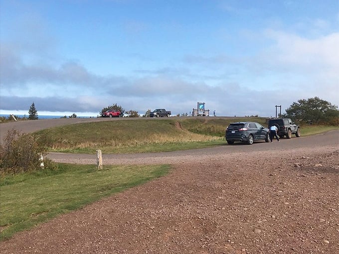 The parking loop at the summit serves as nature's observation deck, where visitors linger in awe of Superior's majesty.