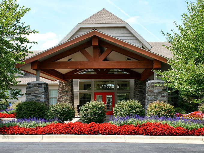 Gardens frame this entrance with such perfect symmetry, it's like the flowers signed a contract promising to behave themselves.