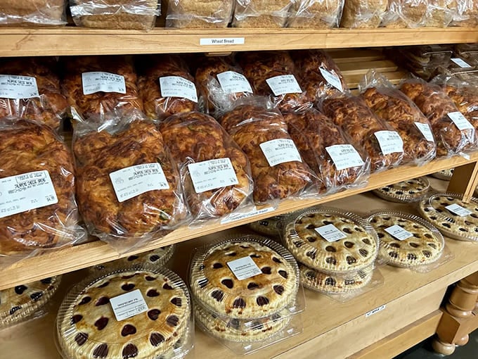 The bakery display &ndash; where cinnamon-swirled breads and hearty loaves compete for your attention, each promising to transform ordinary meals into occasions.