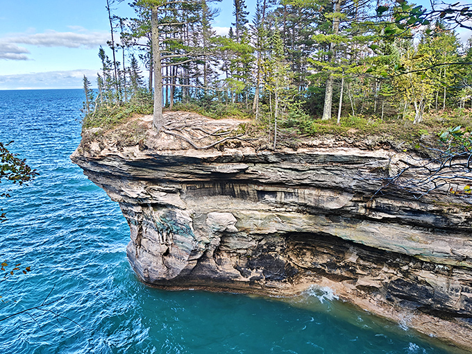 Chapel Cove's emerald waters nestle between towering cliffs, creating a hidden paradise that rewards those willing to make the journey.