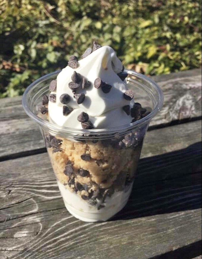 The Cookie Dough Bomb combines two childhood favorites into one cup of pure nostalgia, sprinkled with chocolate chips for good measure.