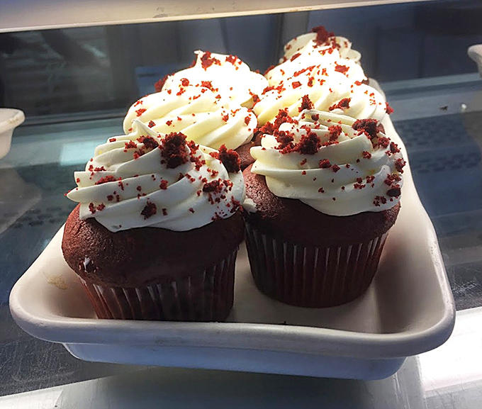 Red velvet cupcakes topped with cream cheese frosting – tiny edible gifts you absolutely deserve, regardless of the occasion.
