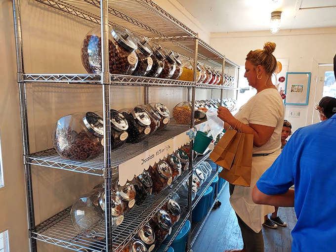 Candy shoppers contemplating their sweet selections with the serious concentration usually reserved for fine wine tasting or art appreciation.