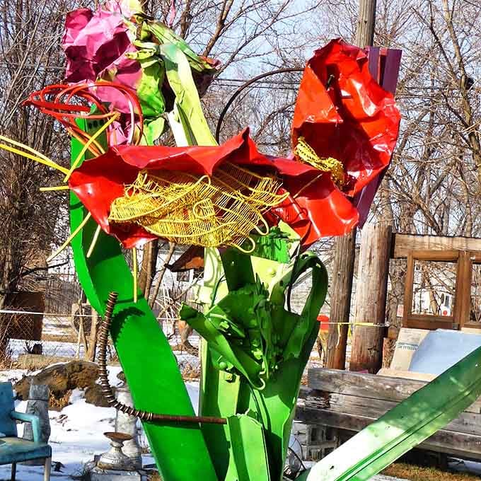 What was once industrial scrap now blooms eternally as metal flowers, their petals catching light instead of raindrops.