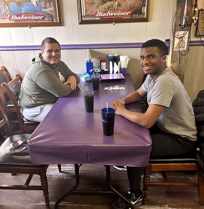 The purple tables have hosted countless conversations, celebrations, and everyday meals &ndash; each one adding another layer to the rich tapestry of this community hub.