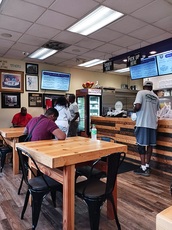 Simple wooden tables and black chairs create an unpretentious dining space where the food, not the decor, becomes the conversation starter.