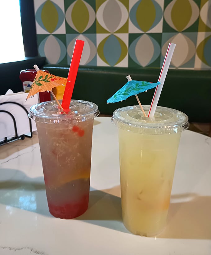 Colorful craft beverages topped with playful paper umbrellas &ndash; because even your drink deserves to wear a tiny hat at this celebration.