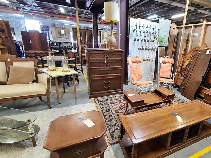 Furniture vignettes create little islands of different eras throughout the sprawling warehouse space.