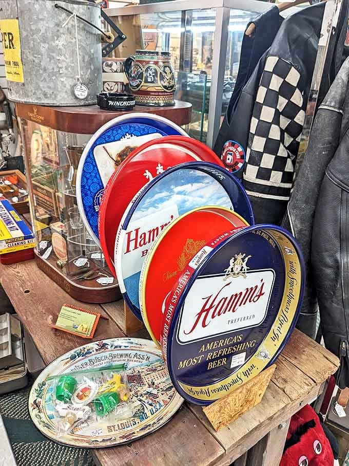 Vintage Hamm's beer trays stack up colorfully, each a circular time capsule of mid-century graphic design and advertising.