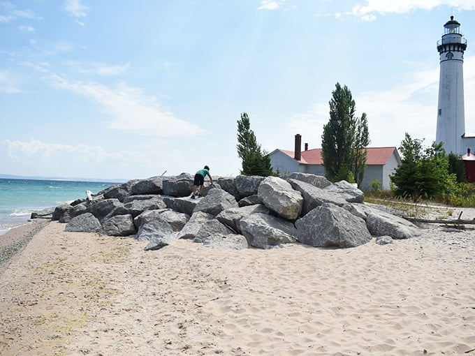 The iconic lighthouse stands sentinel over the shoreline, a postcard-perfect reminder of Lake Michigan's maritime heritage and enduring charm.