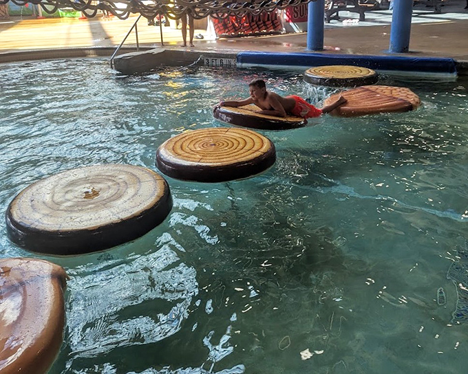The log walk challenge continues to humble parents while children bounce across like they're auditioning for American Ninja Warrior: Waterpark Edition.