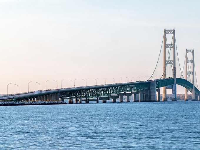 The approach span stretches toward the horizon, carrying travelers on a journey between Michigan's two distinct worlds.