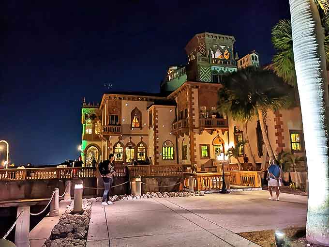 At night, Ca' d'Zan glows like a jewel box someone forgot to close, spilling golden light across the water in the most photogenic way possible.