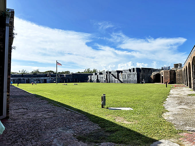 The fort's central courtyard offers a moment of sunshine between explorations of the shadowy interior spaces where history feels uncomfortably present.