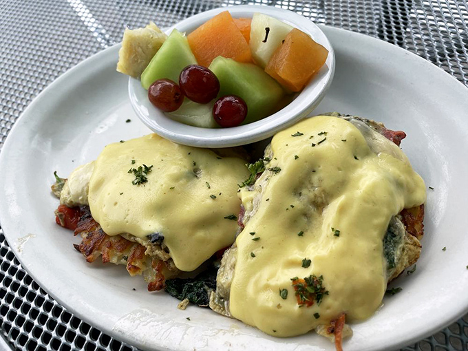 Portabella Benedict Scramble: Breakfast elevated to art form &ndash; earthy mushrooms, fresh vegetables, and rich hollandaise create morning magic on a plate.