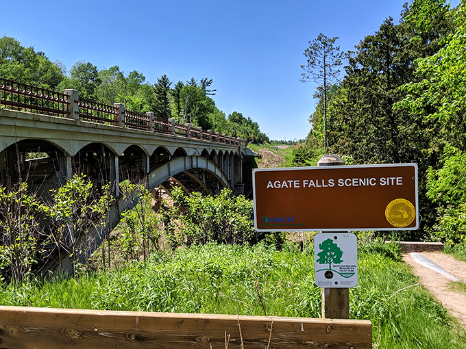 The welcoming sign at Agate Falls Scenic Site &ndash; where nature's spectacular show begins just beyond this unassuming entrance.