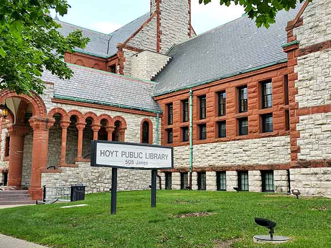 More than just an address marker, this sign stands as a community beacon, promising knowledge and connection to all who enter.