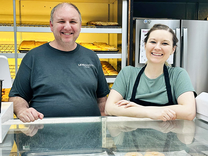 The smiling faces behind the counter prove that happiness is contagious, especially when you're surrounded by fresh-baked goods all day.