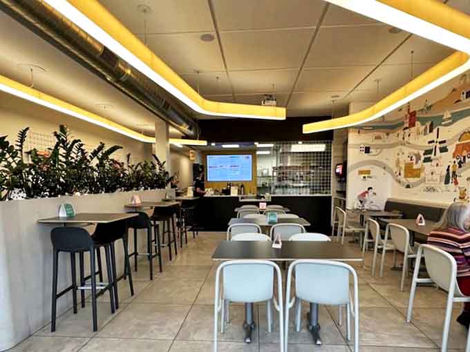 Modern, minimalist design with pops of yellow creates an atmosphere that's both Instagram-worthy and genuinely comfortable for lingering over tacos.