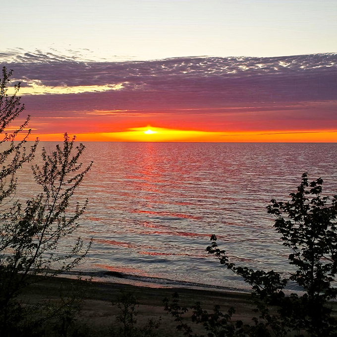 Lake Superior sunsets are the kind that make you forget about your phone and just stand there like a tourist in your own state.
