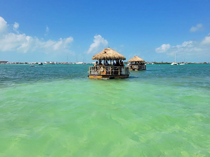 A flotilla of tiki bars creates a charming sight against the backdrop of impossibly clear turquoise waters – Key West's newest iconic image.