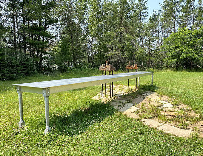 The "Water Table" waits eternally for dinner guests who never arrive – or perhaps they've just stepped away momentarily.