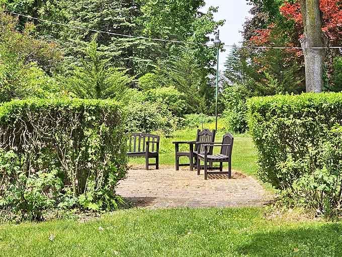 A secluded garden nook where one might read poetry, exchange whispered confidences, or simply escape the summer heat.