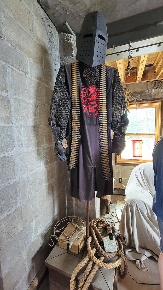 Not your average coat rack! This impressive suit of armor stands guard in the castle, complete with chainmail and an intimidating helmet.