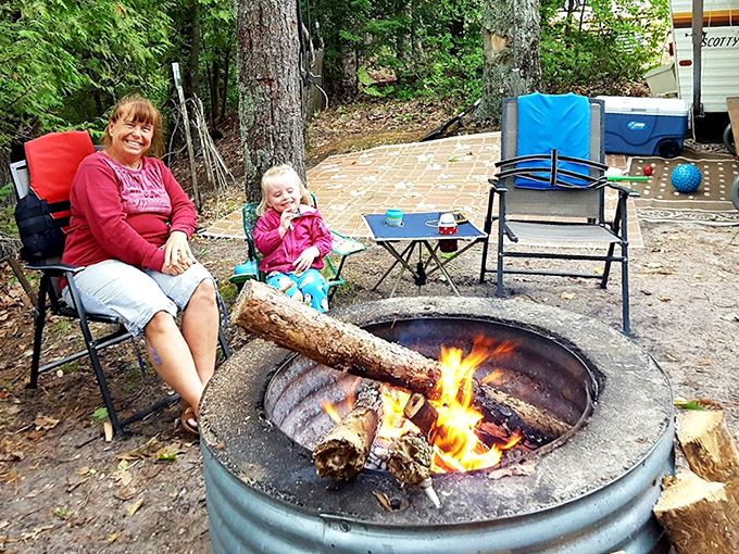 Generations gather around dancing flames, where s'mores taste better and stories grow taller with each telling.